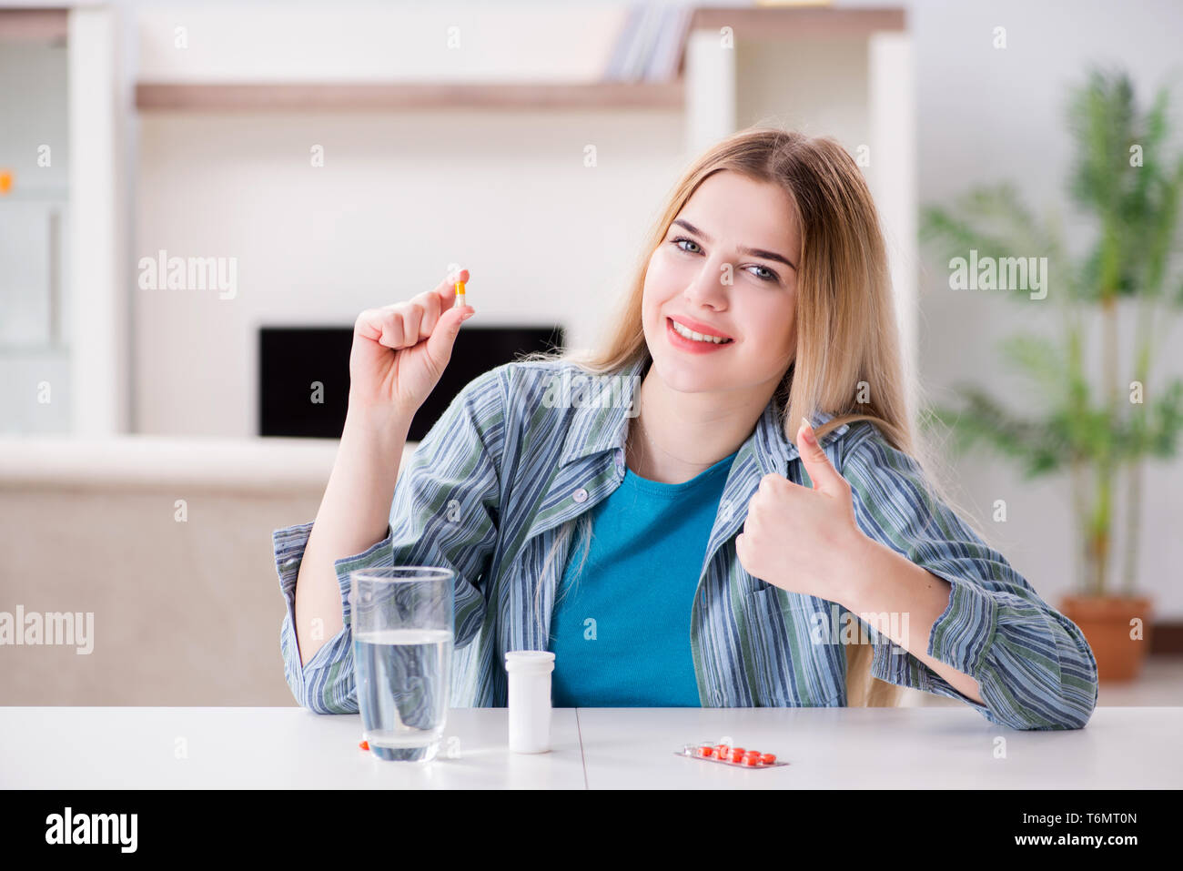 Thumbs up woman pill hi-res stock photography and images - Alamy