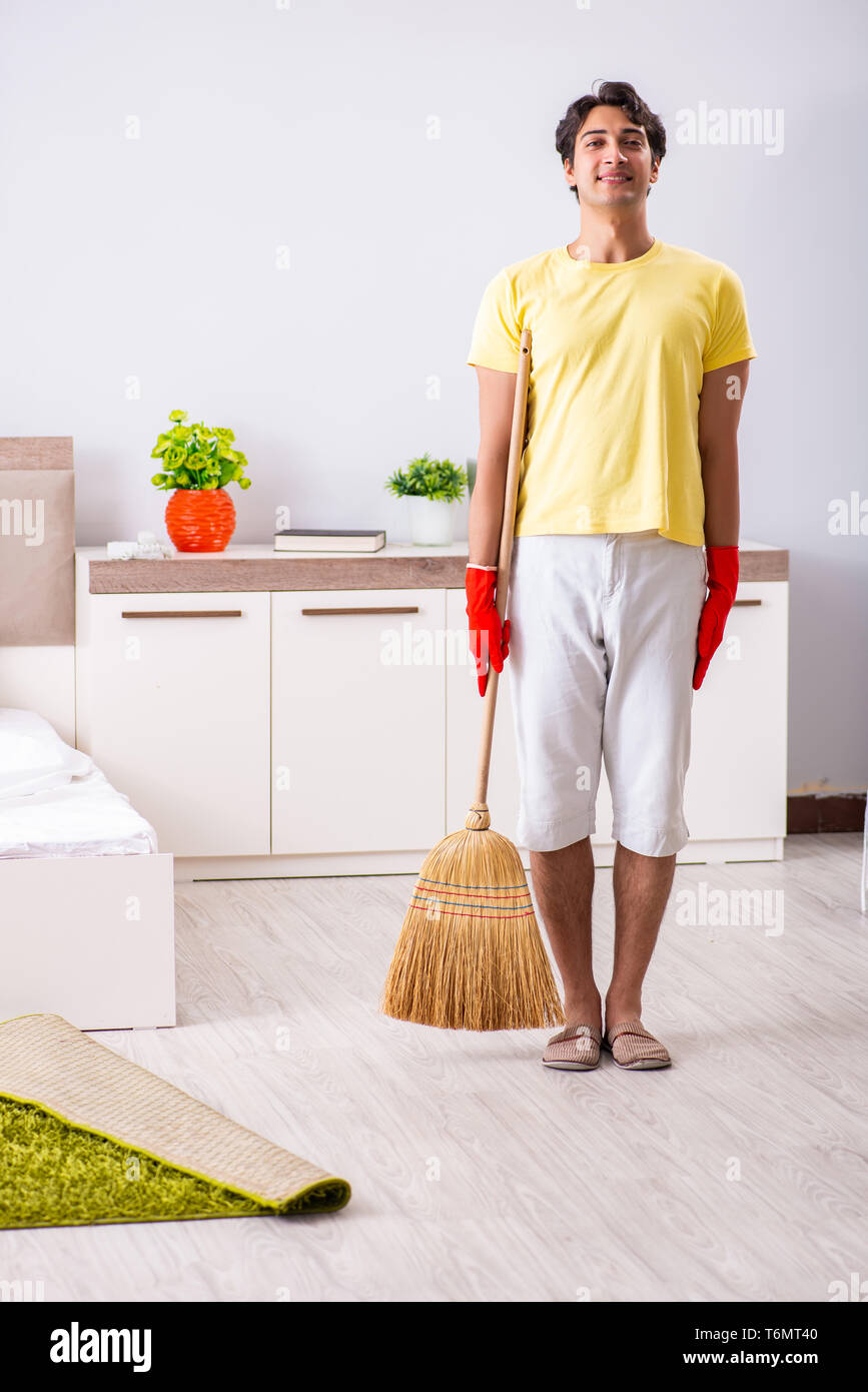 Happy man ready to cleaning the house hi-res stock photography and ...