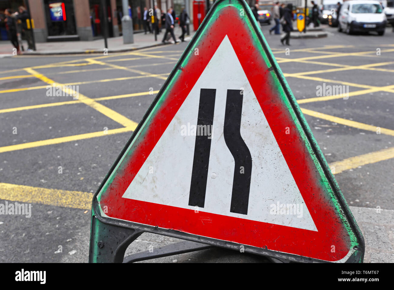 Road narrows traffic sign at the street intersection Stock Photo - Alamy
