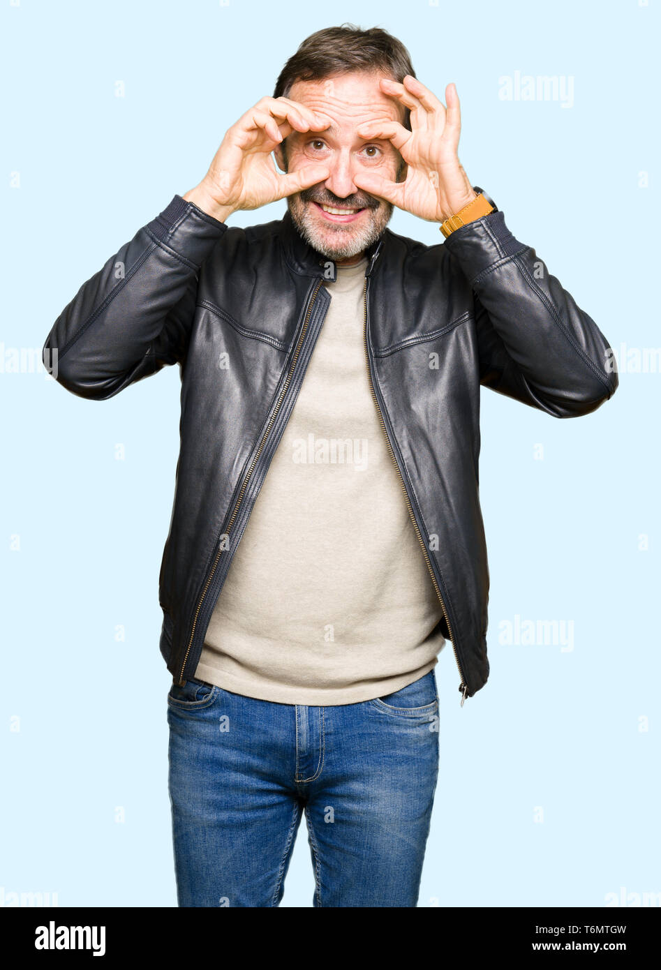 Middle age handsome man wearing black leather jacket Trying to open ...