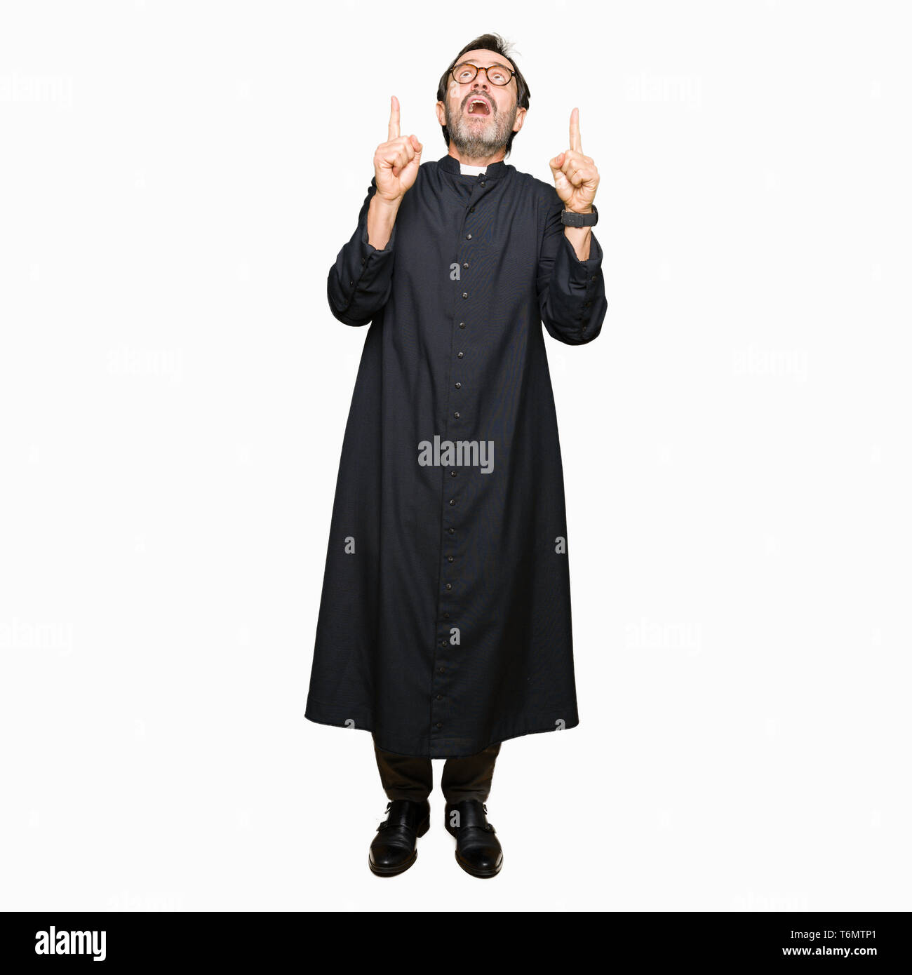 Priest looking up isolated Cut Out Stock Images & Pictures - Alamy
