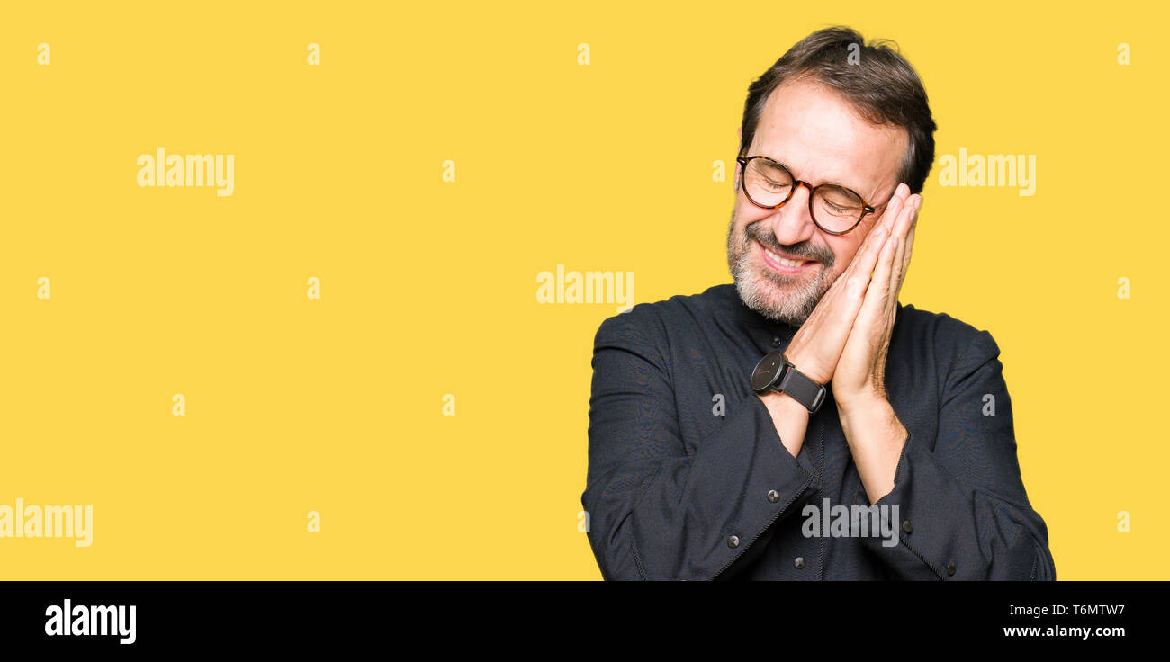 Middle age priest man wearing catholic robe sleeping tired dreaming and ...