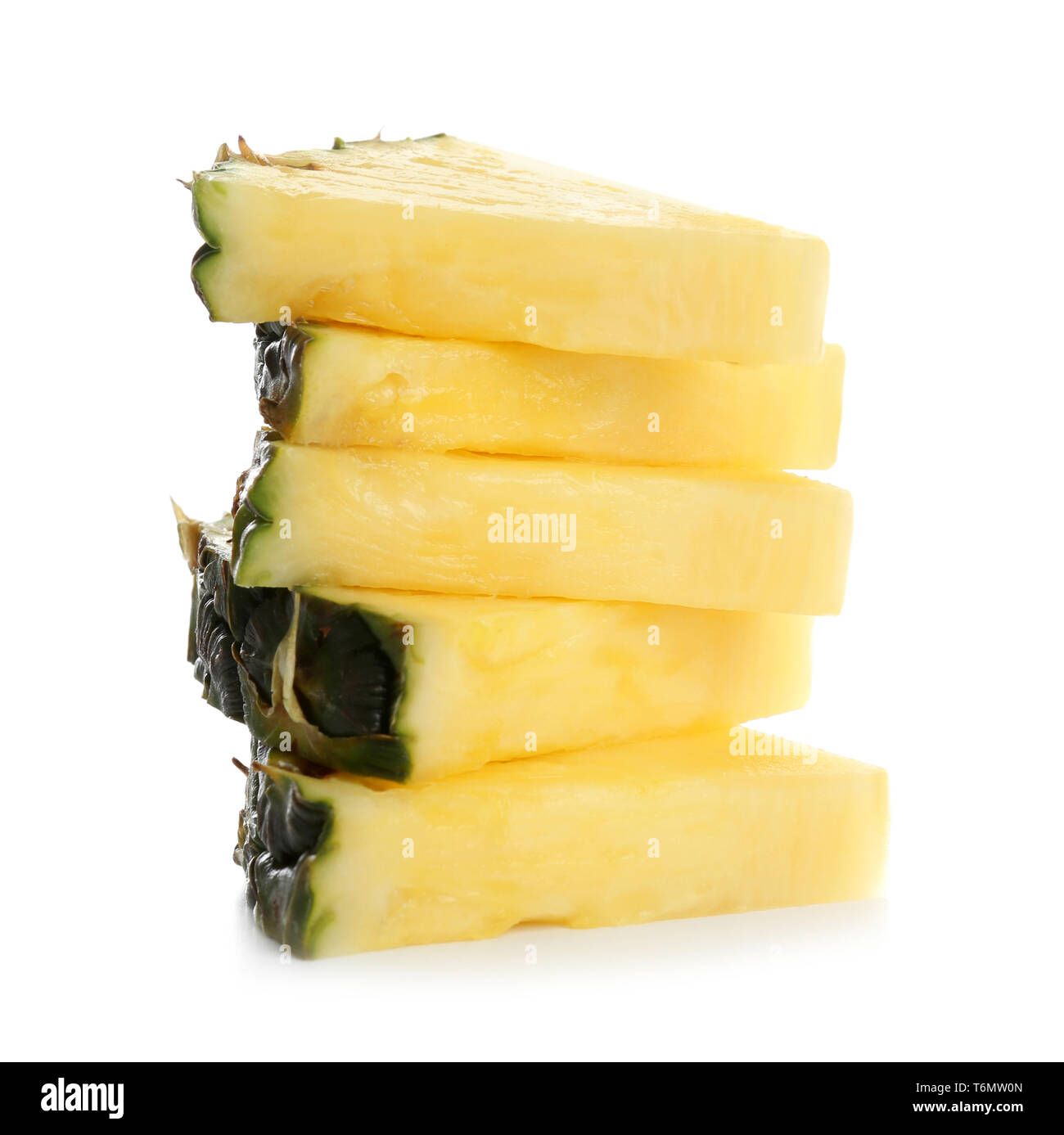 Slices of ripe pineapple on white background Stock Photo - Alamy