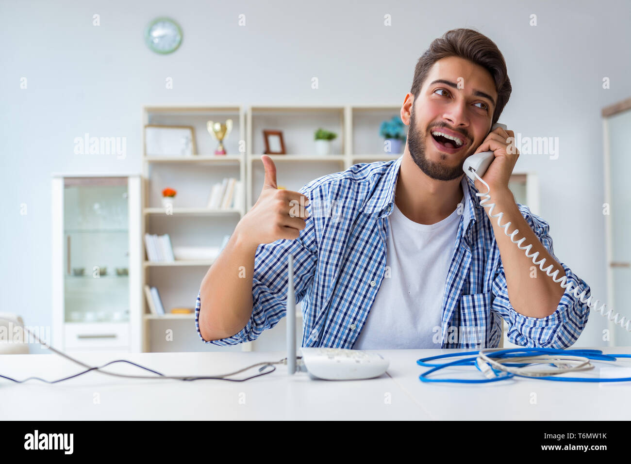 Man enjoying fast internet connection Stock Photo - Alamy