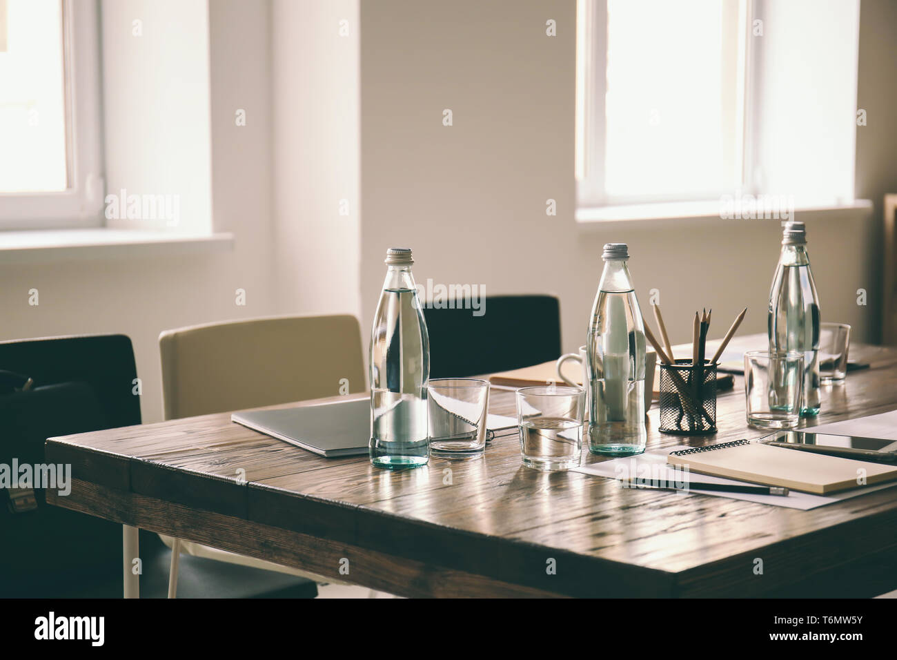 Table prepared for business meeting in conference hall Stock Photo - Alamy