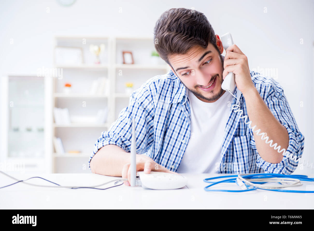 Man enjoying fast internet connection Stock Photo - Alamy
