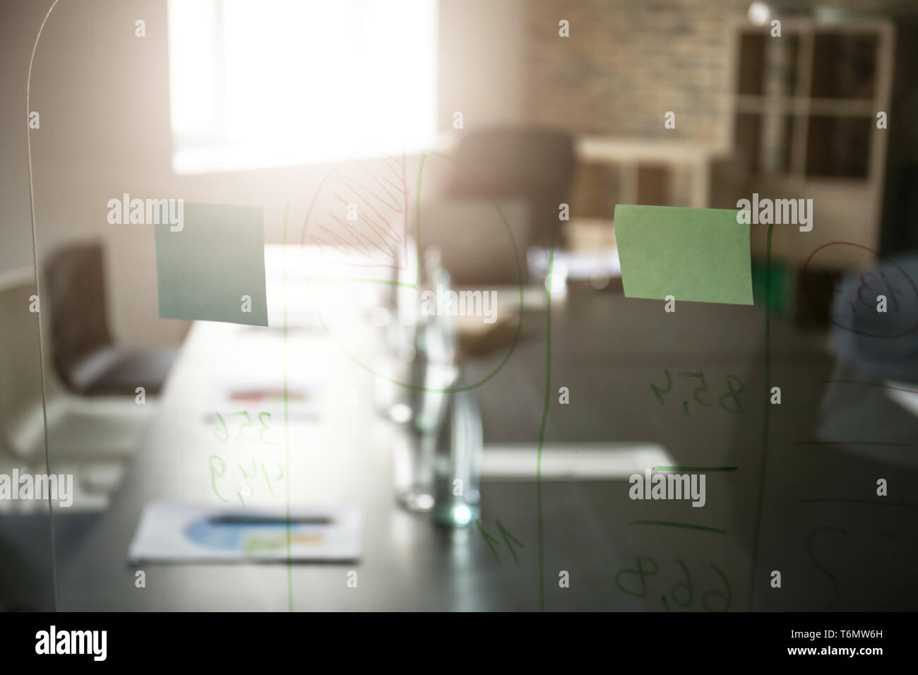 Table prepared for business meeting in conference hall. View through ...