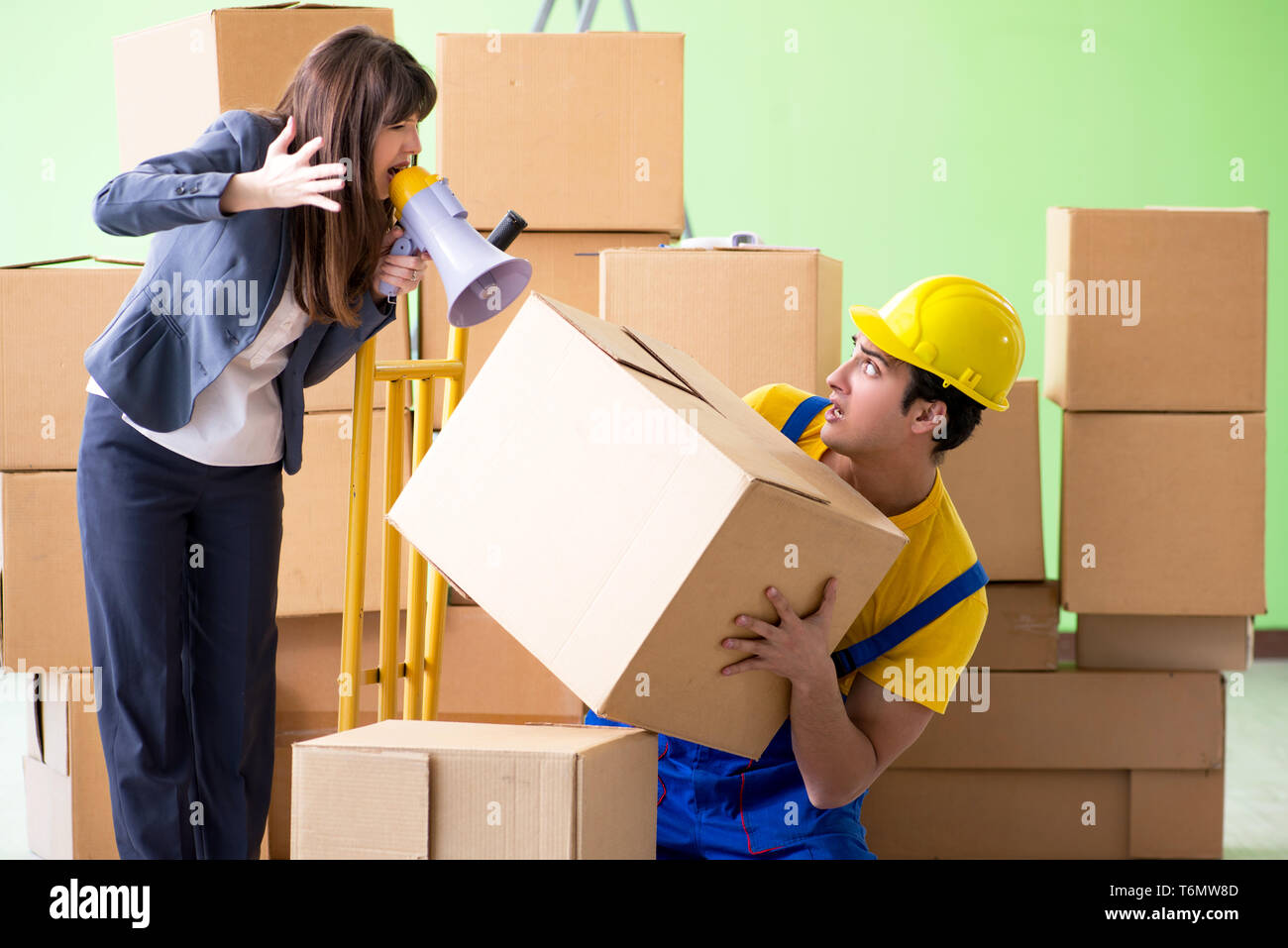 Woman boss and man contractor working with boxes delivery Stock Photo ...