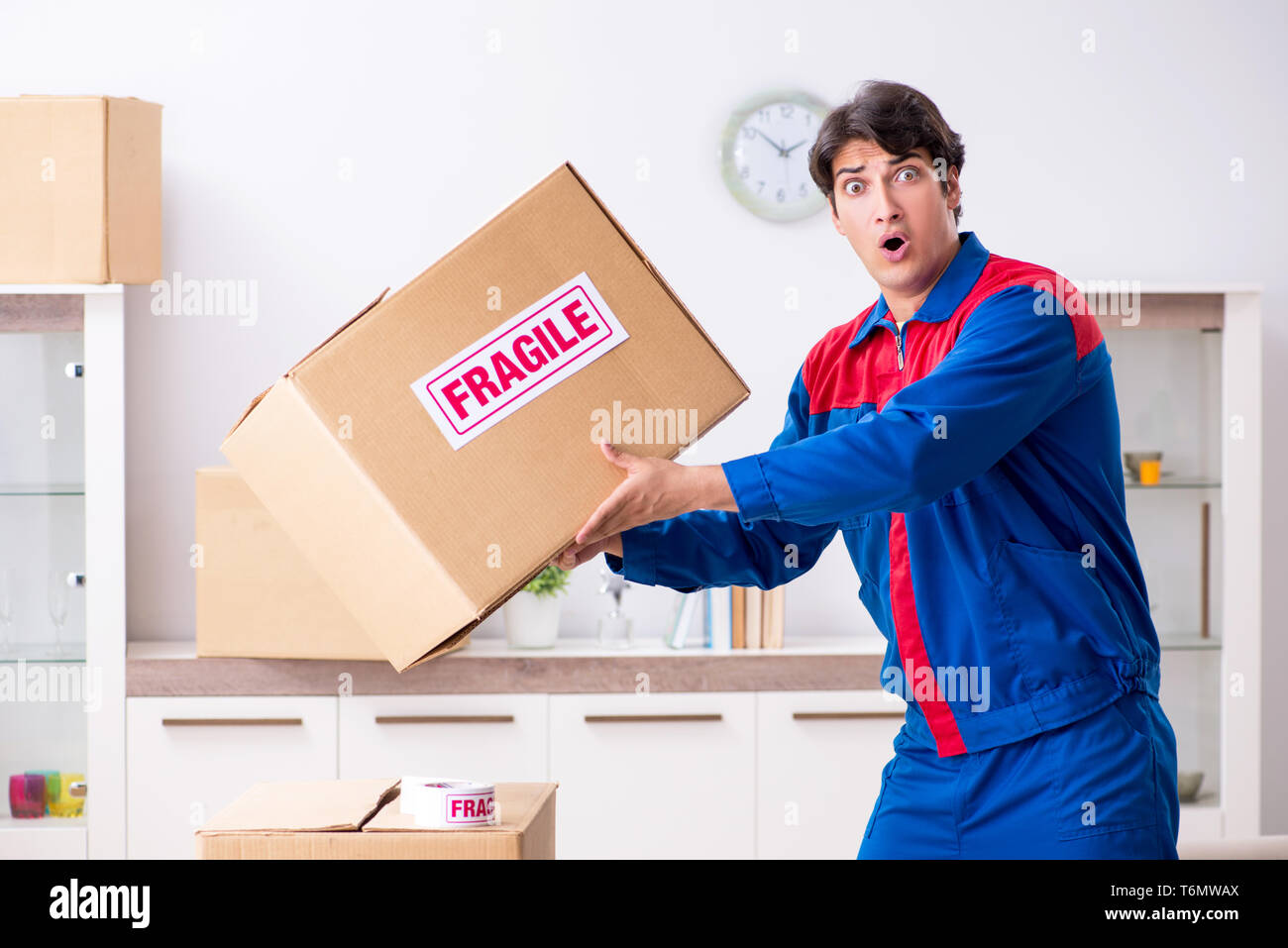 Transportation contractor with fragile boxes Stock Photo - Alamy