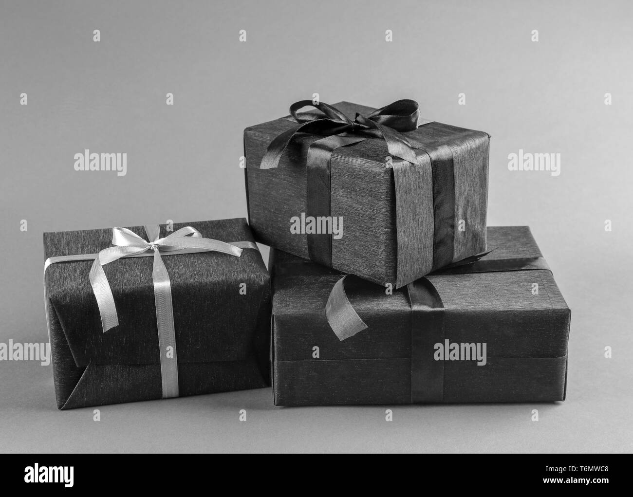 Elegant gift boxes on gray background Stock Photo - Alamy