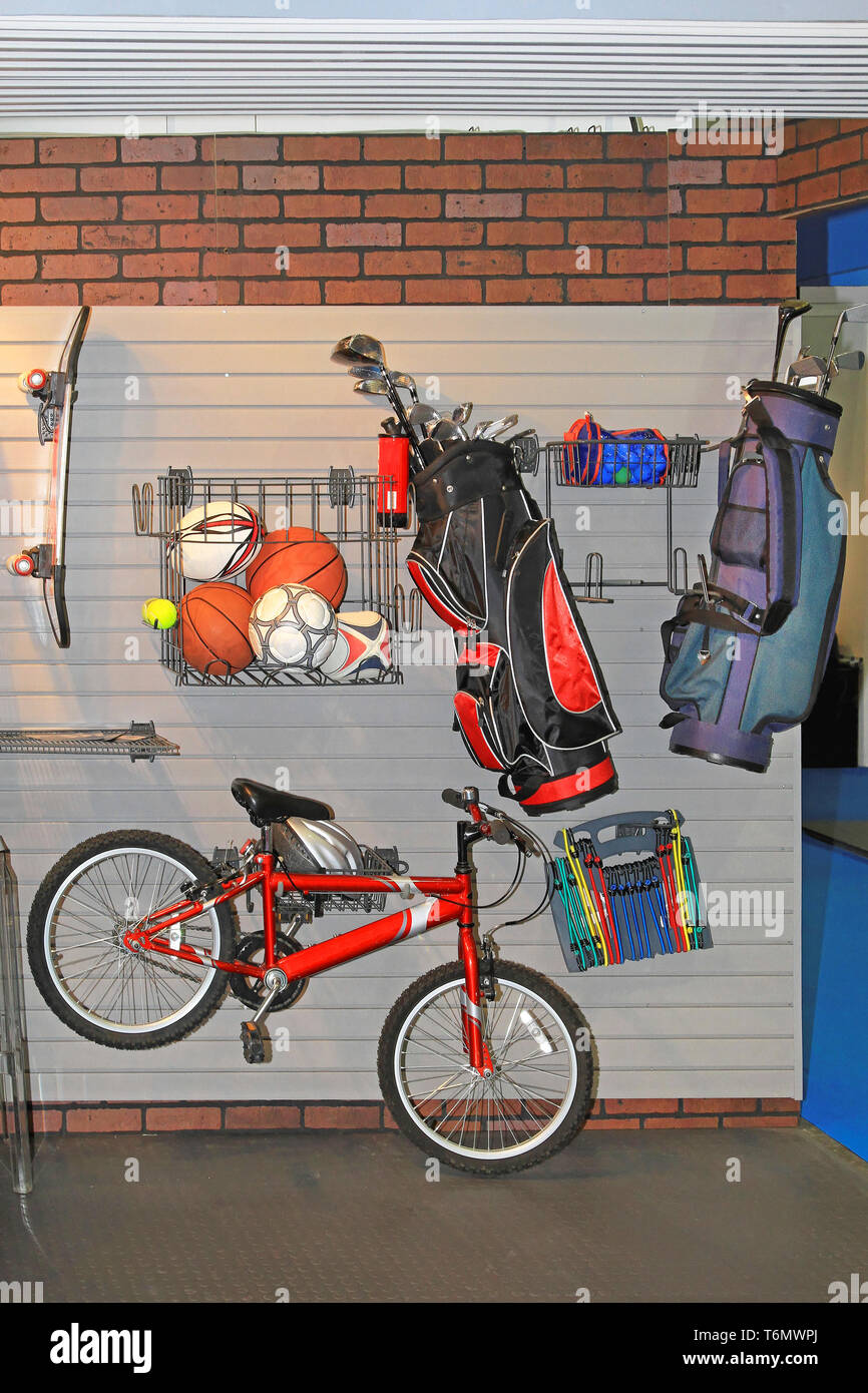 Wall mounted rack shelving for storage in garage Stock Photo - Alamy
