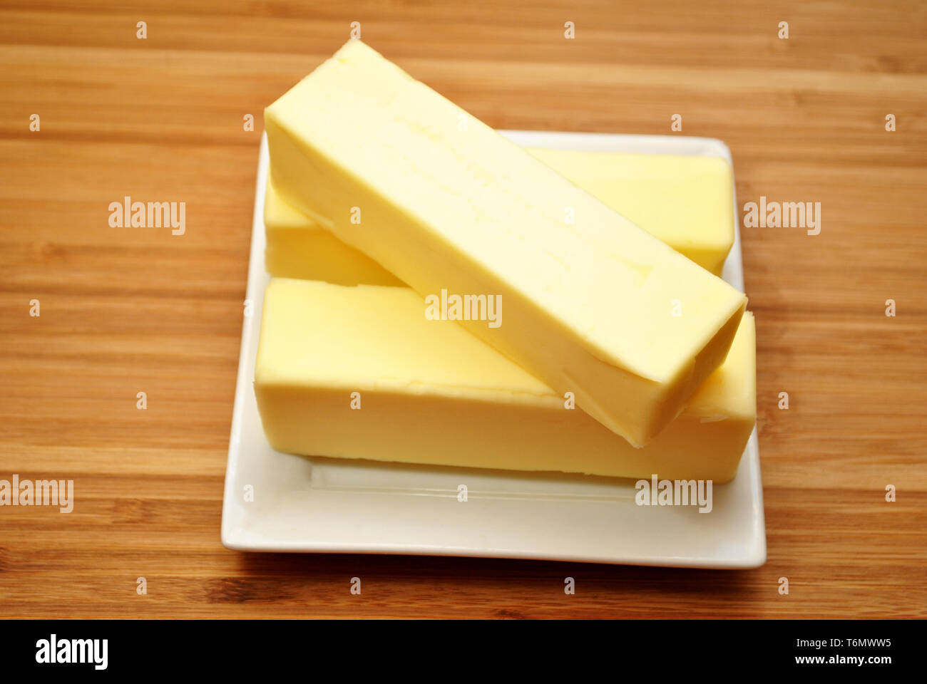 Three Sticks of Butter Stock Photo - Alamy