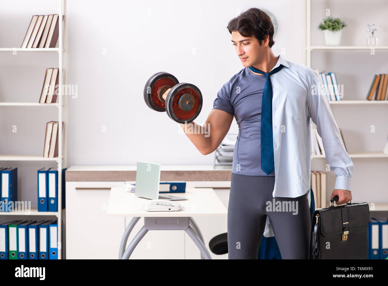 Employee combining work and healthy lifestyle Stock Photo - Alamy