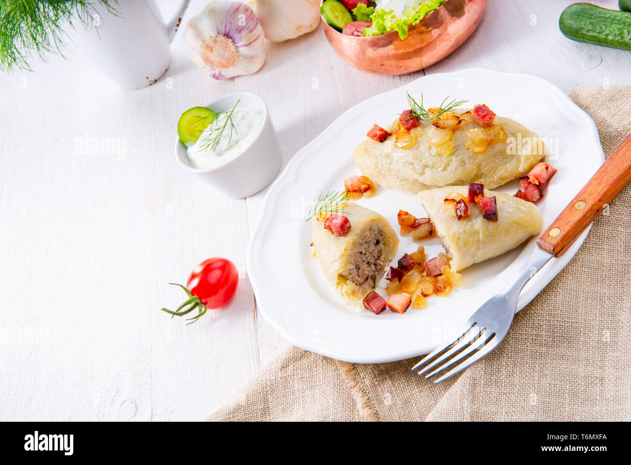 Rustic Cepelinai, a specialty Lithuanian and Polish cuisine Stock Photo ...