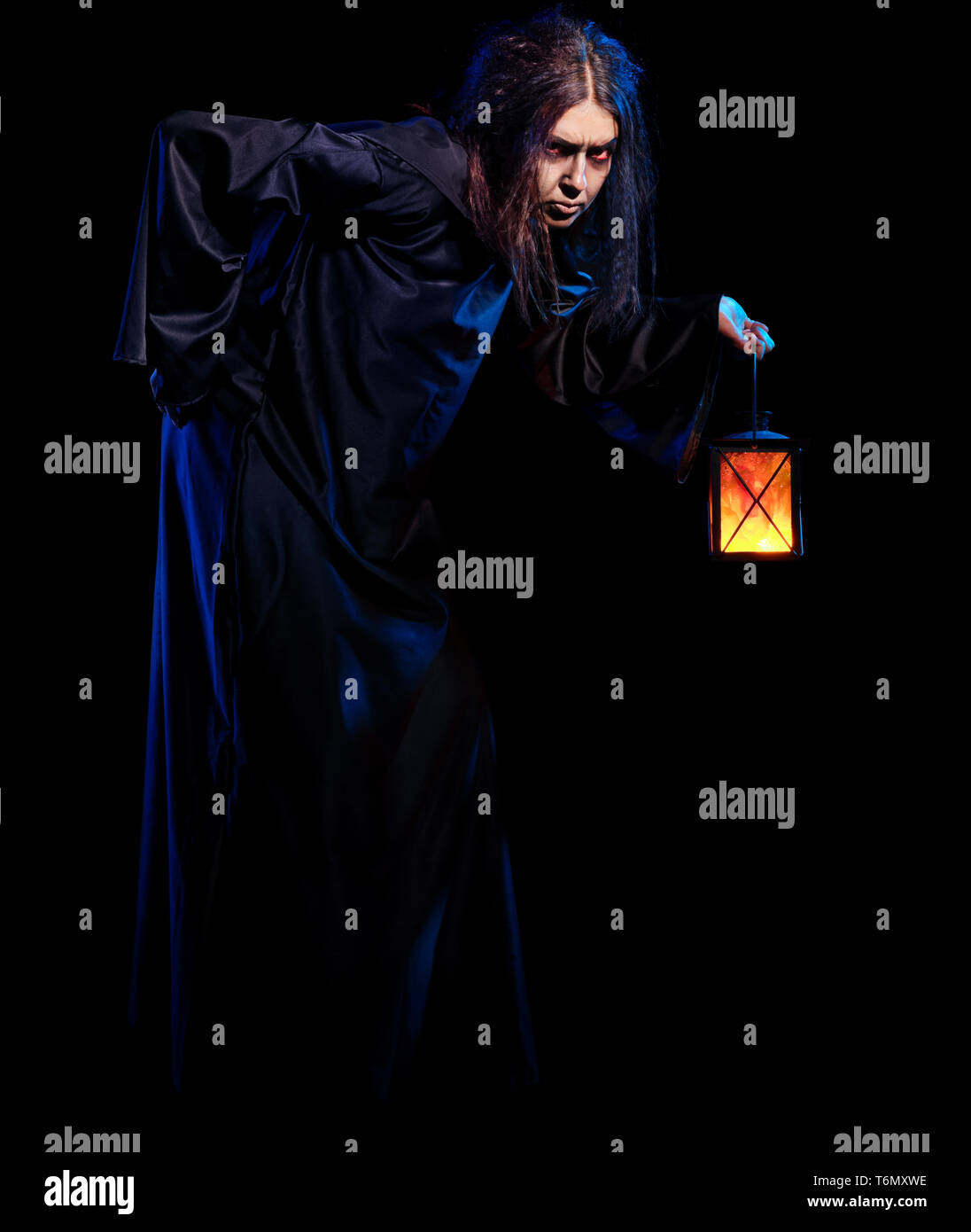 Scary witch isolated on black Stock Photo - Alamy