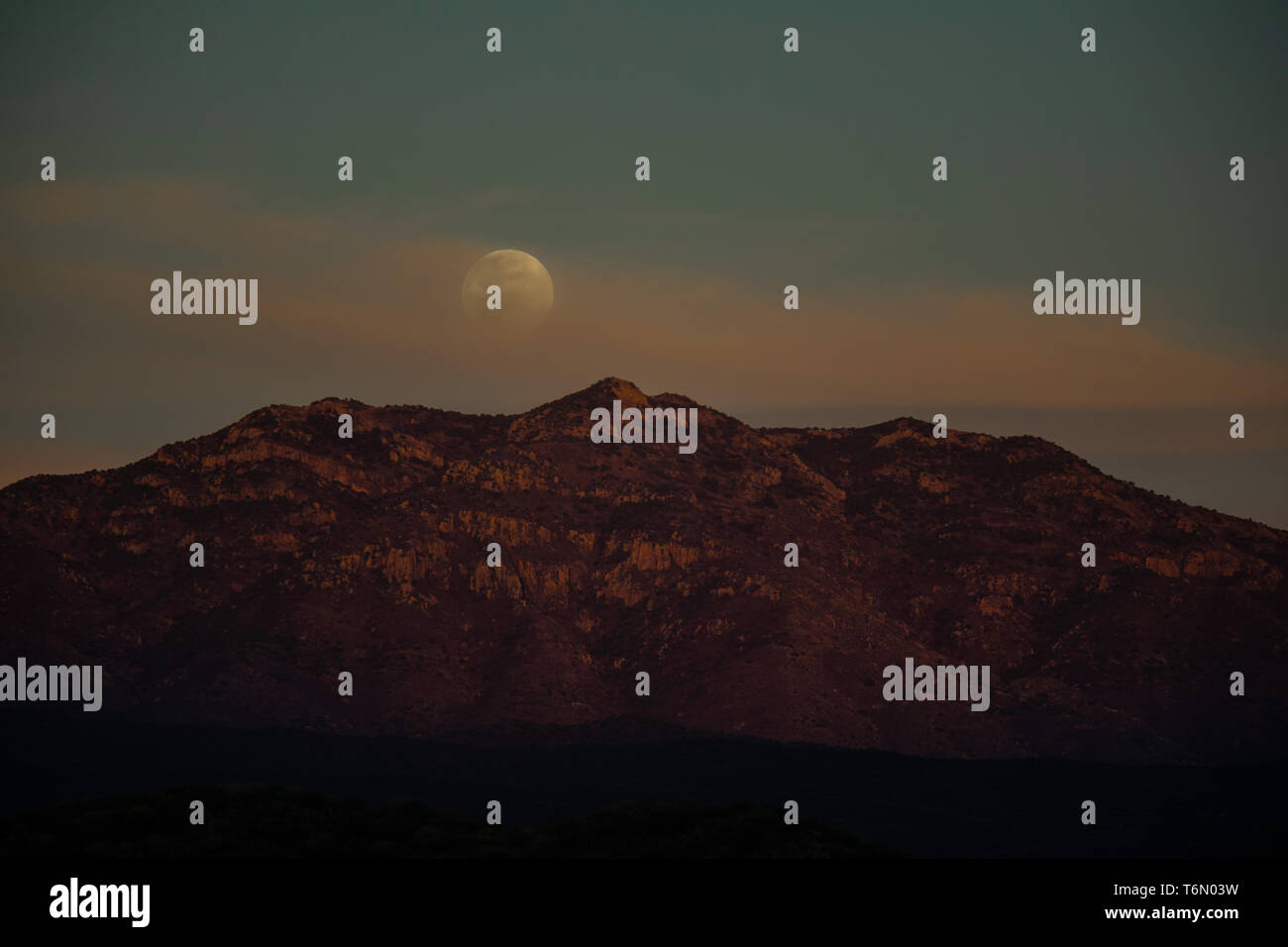 Full moon seen over the hills of the Ruta de la Sierra and near ...