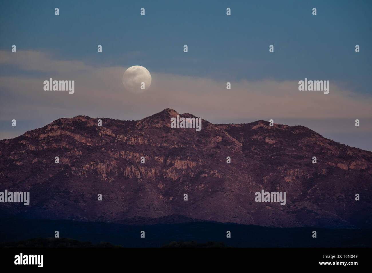 Full moon seen over the hills of the Ruta de la Sierra and near ...