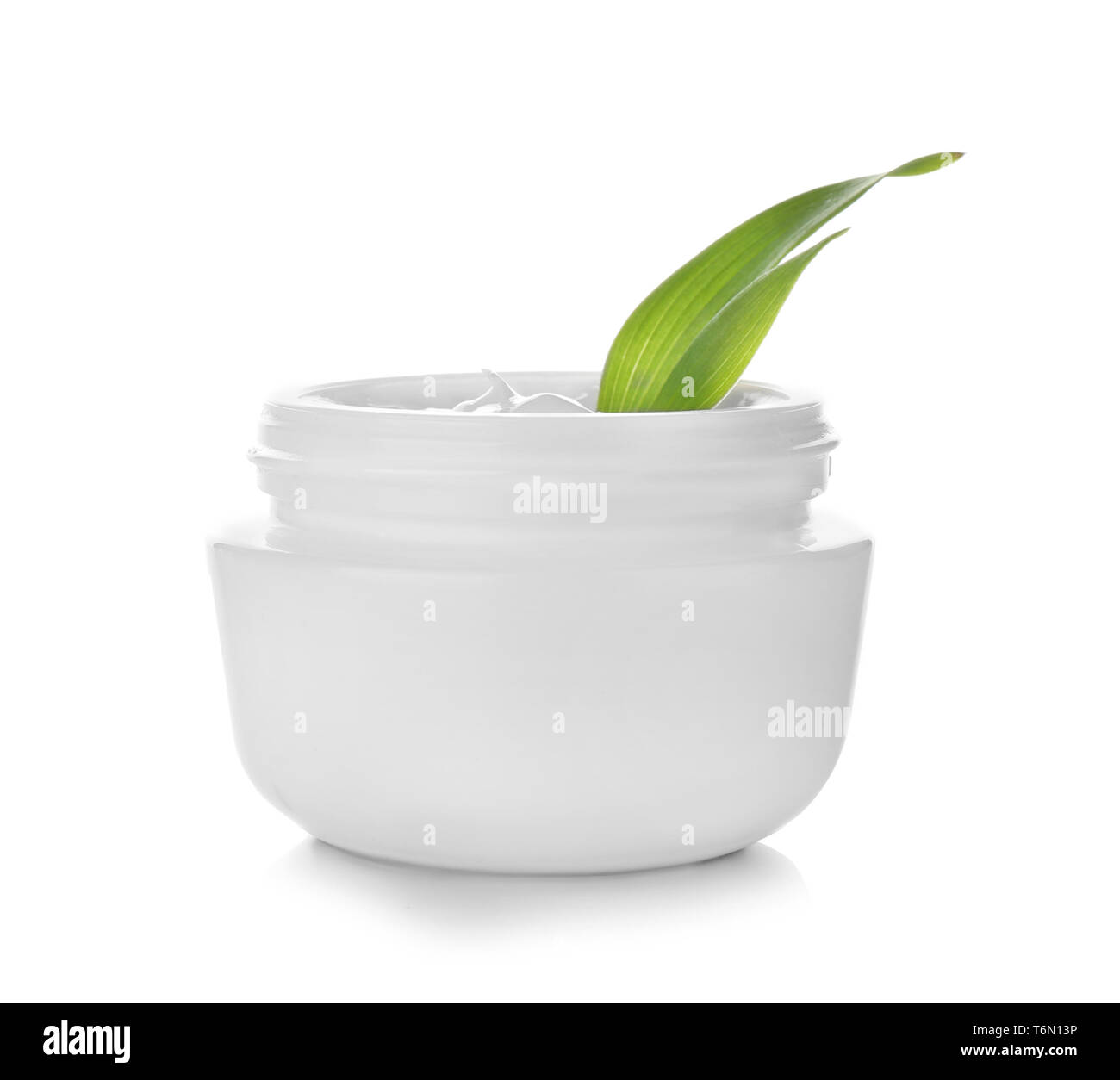 Jar of cream with herbal extract on white background Stock Photo - Alamy