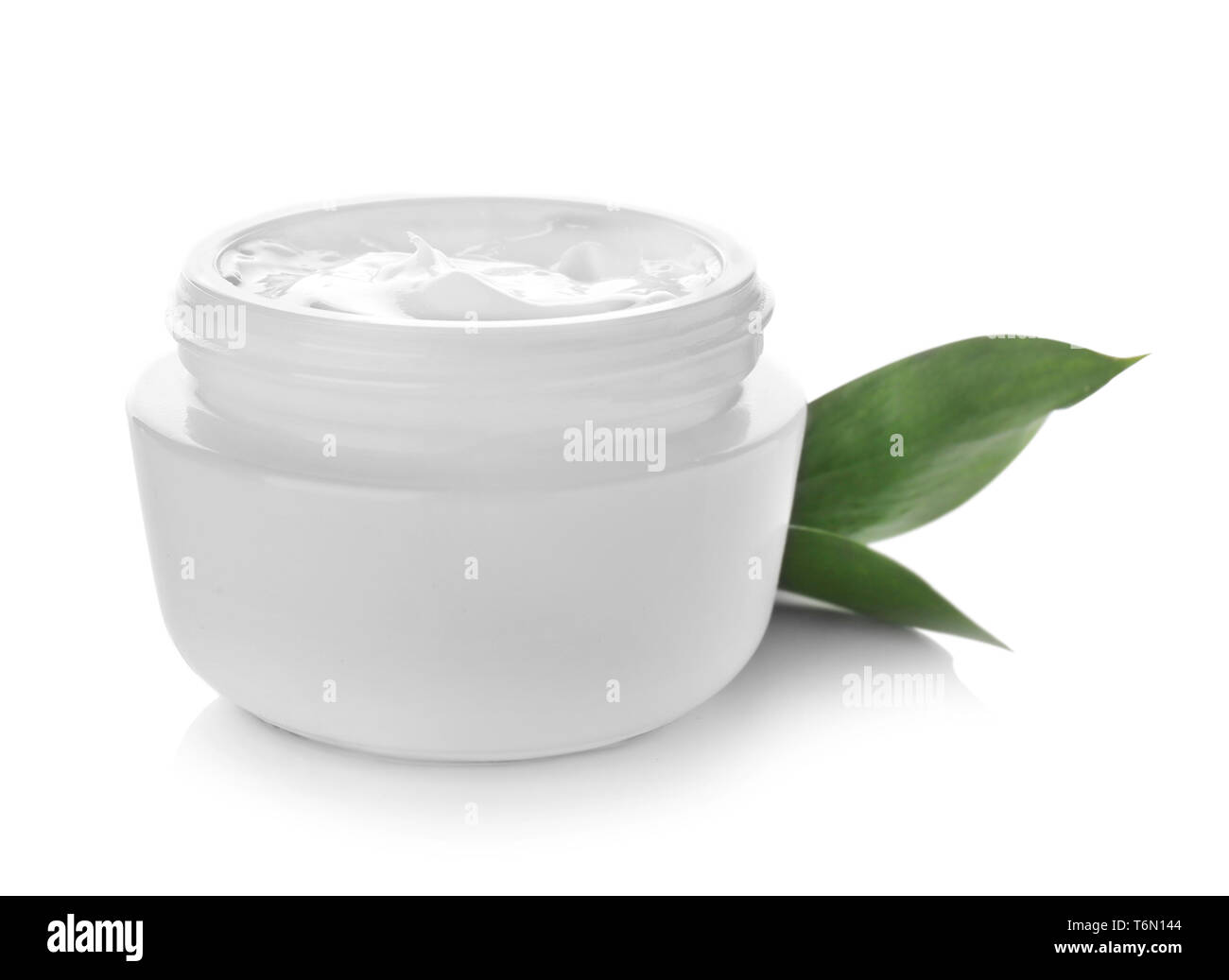 Jar of cream with herbal extract on white background Stock Photo - Alamy
