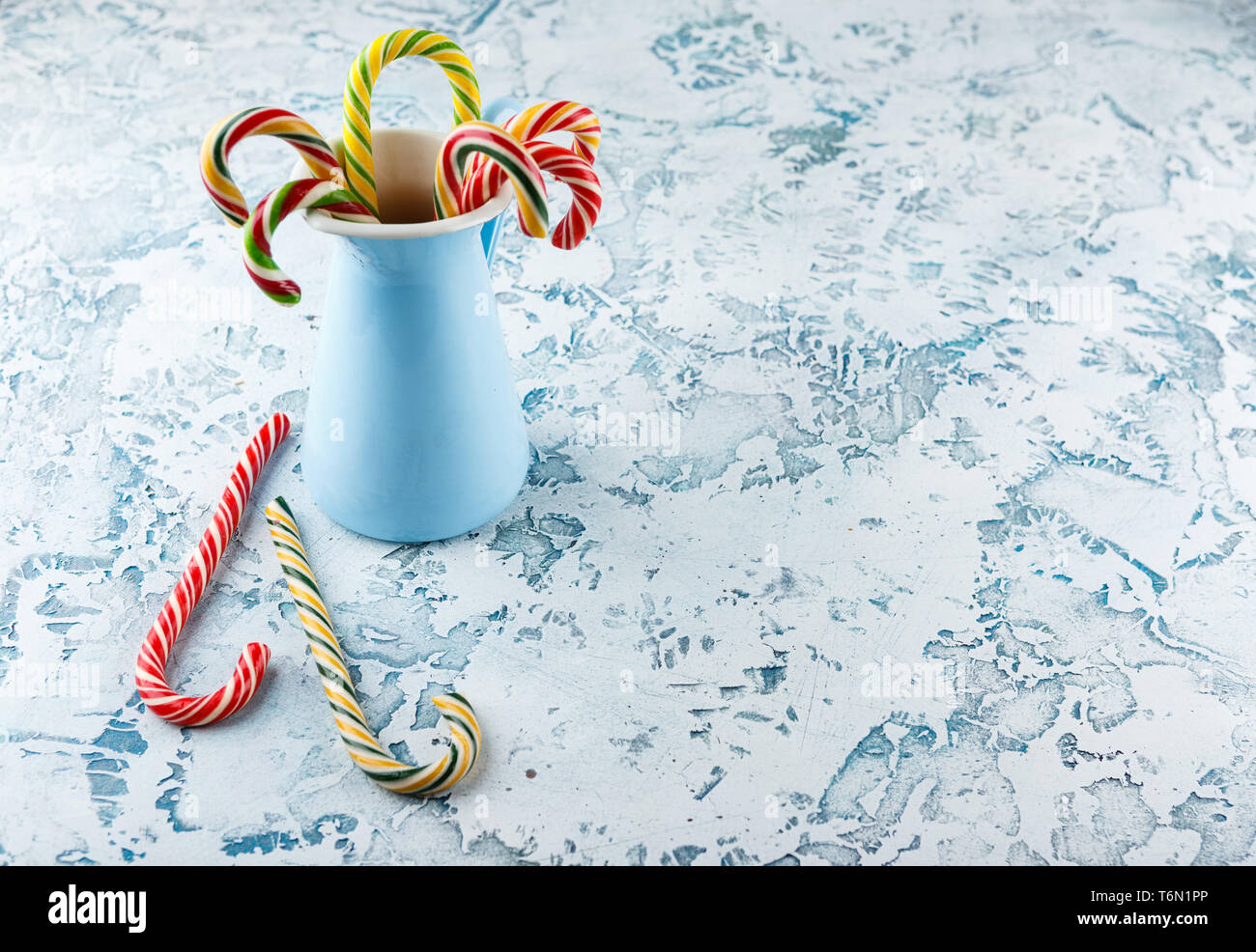 Christmas decors with light background. Candy cane Stock Photo - Alamy