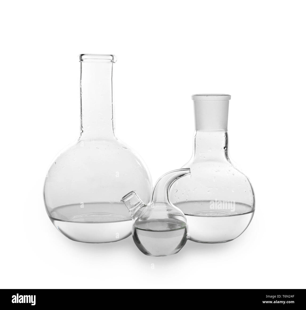 Chemical glassware with water on white background Stock Photo - Alamy