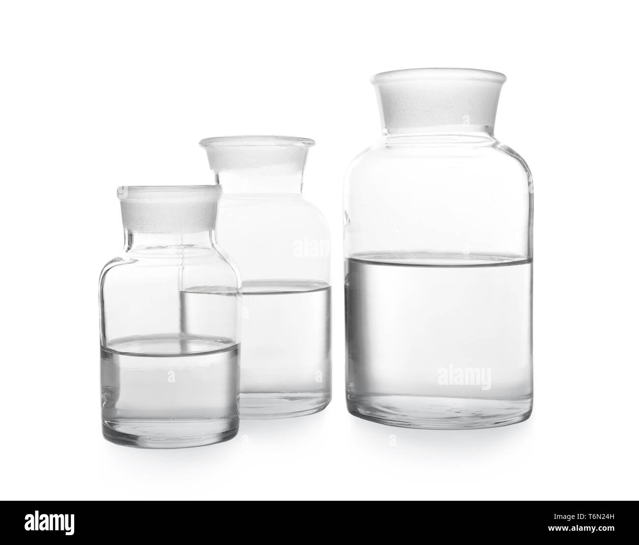 Glass bottles with water on white background Stock Photo - Alamy