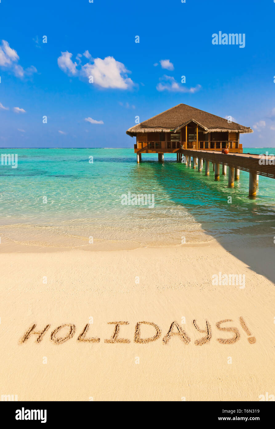 Word Holidays on beach Stock Photo - Alamy