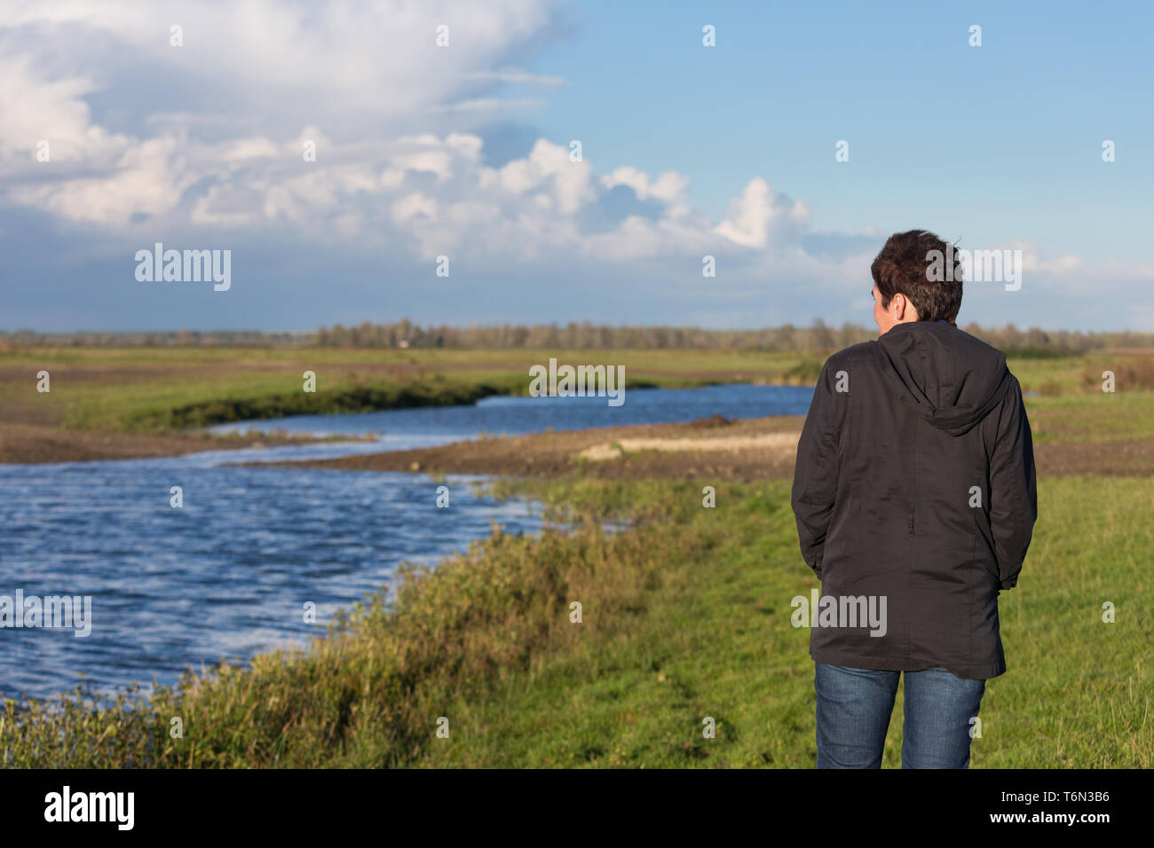 Woman in a beautiful wetland landscape in the Netherlands Stock Photo ...
