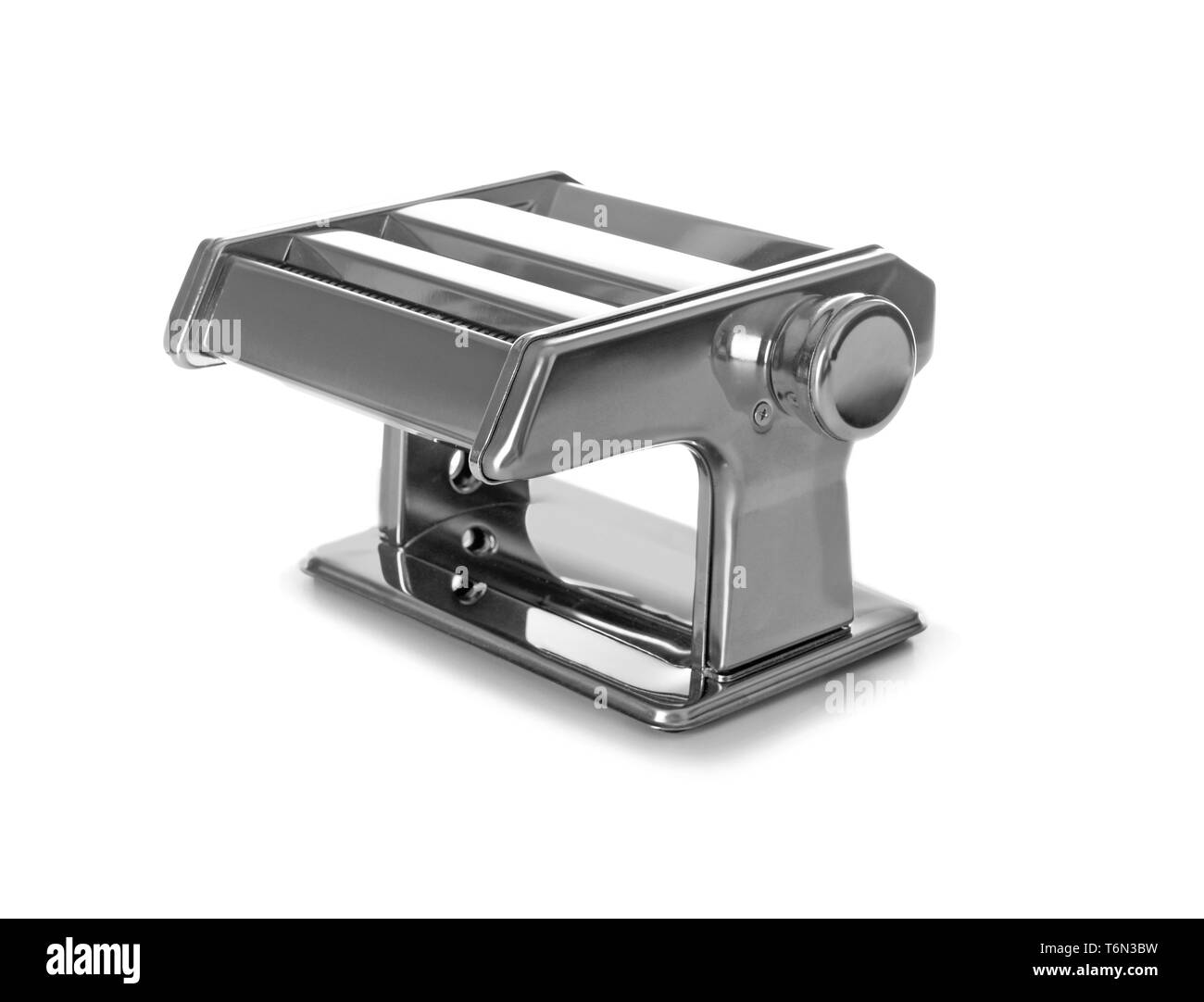 Metal pasta machine on white background Stock Photo - Alamy