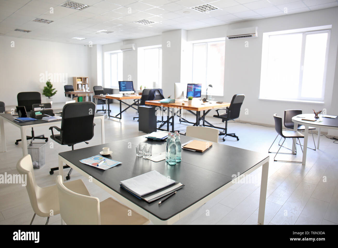 Office interior with tables and chairs. Workplace design Stock Photo ...