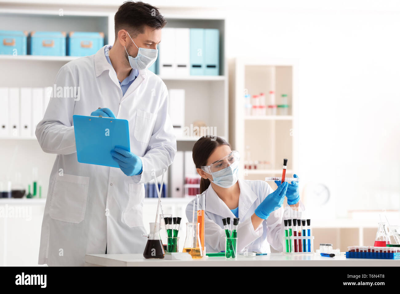 Man woman scientists writing hi-res stock photography and images - Alamy