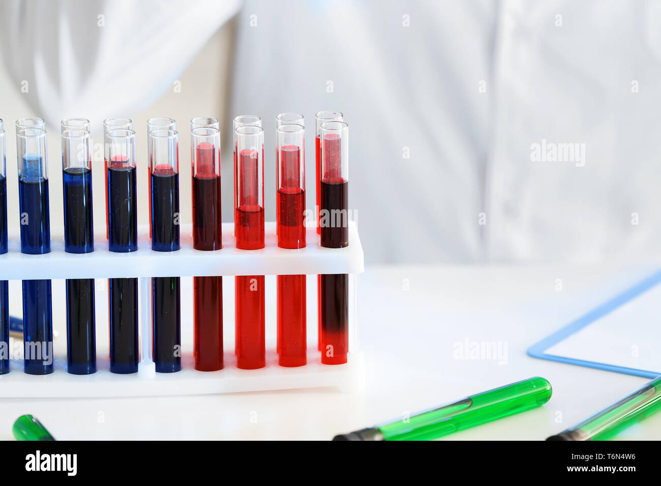 Test tubes with color samples on table in laboratory Stock Photo - Alamy