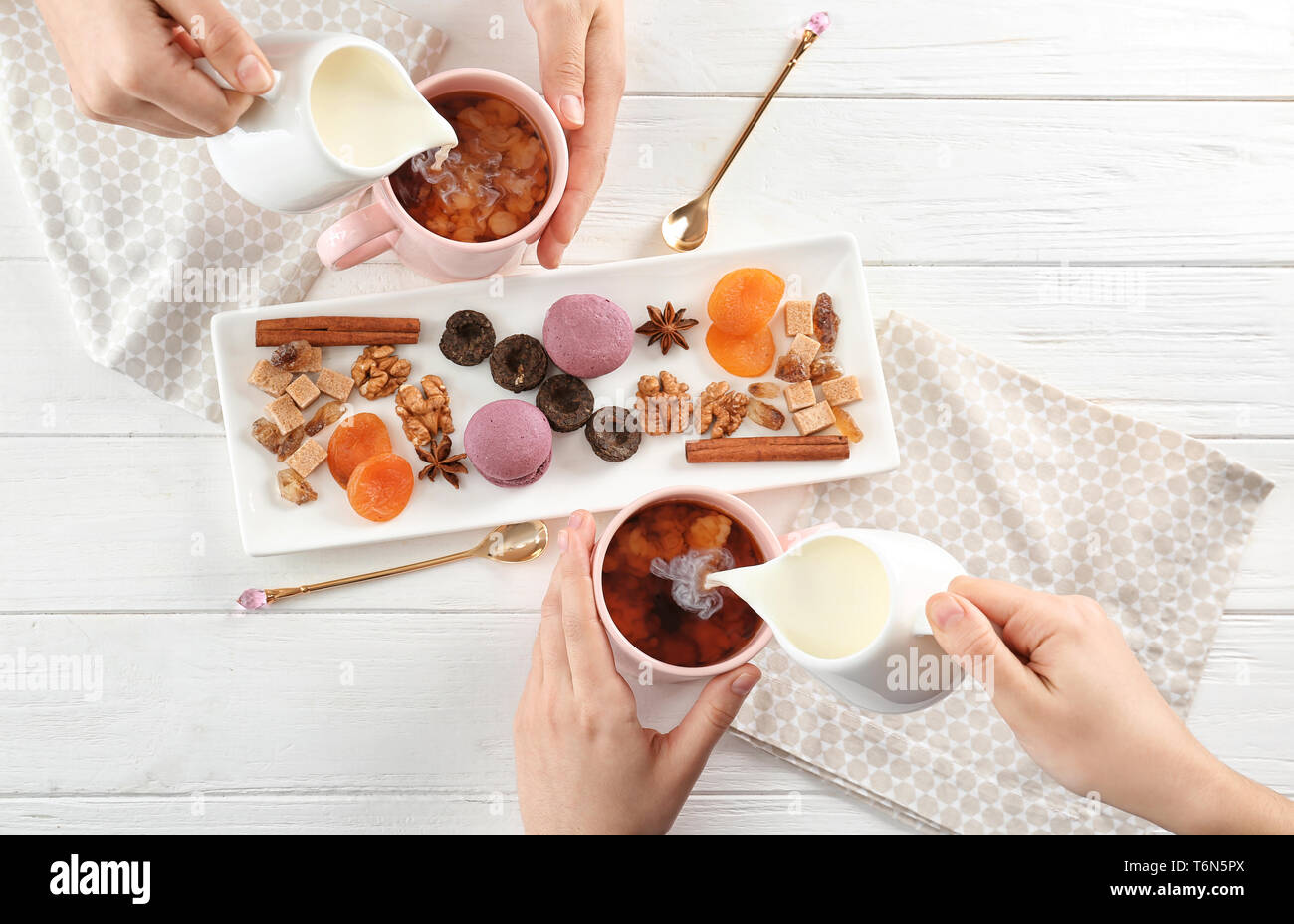 Pouring milk into tea top hi-res stock photography and images - Alamy