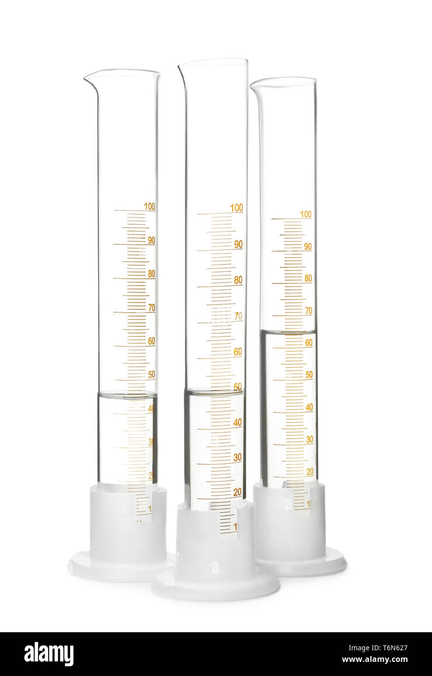 Graduated cylinders with liquid on white background Stock Photo - Alamy