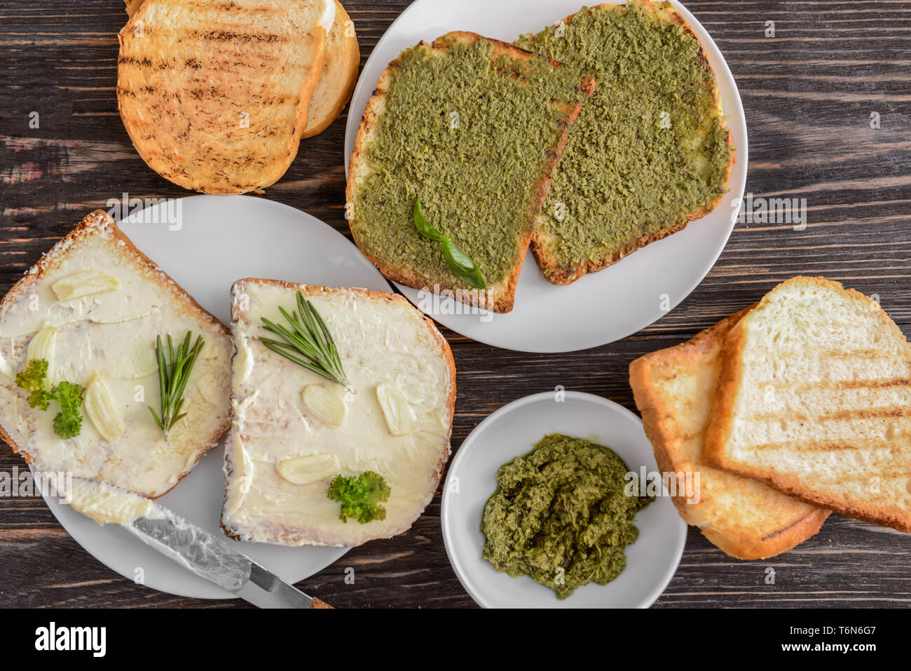 Flat lay composition with tasty toasted bread on table Stock Photo - Alamy