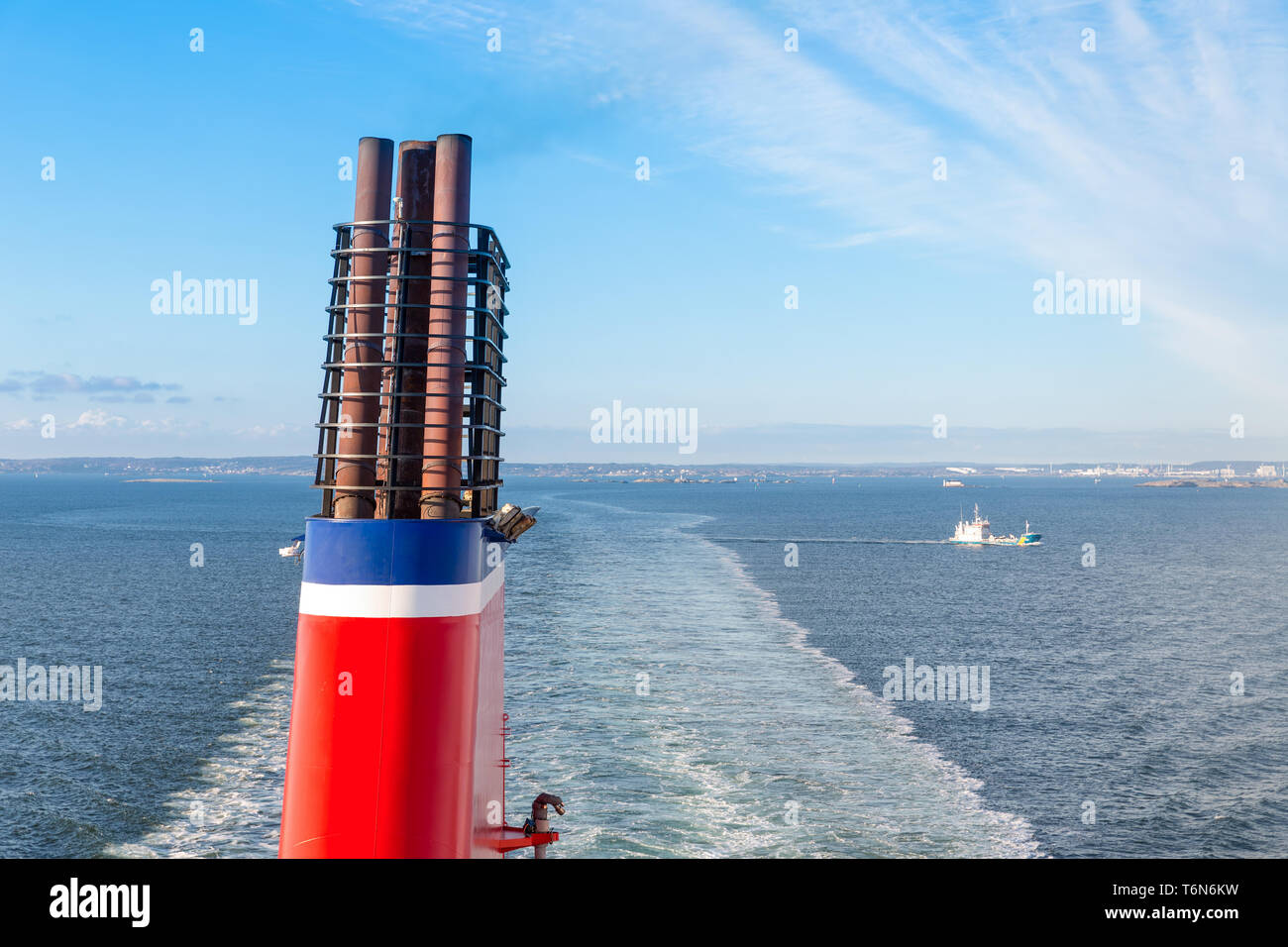 Chimney at a ship sailing a a blue sea Stock Photo - Alamy