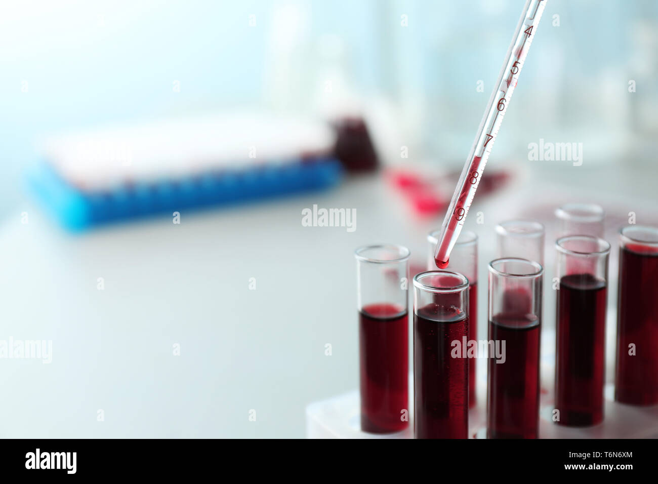 Dripping blood into test tubes, closeup Stock Photo - Alamy