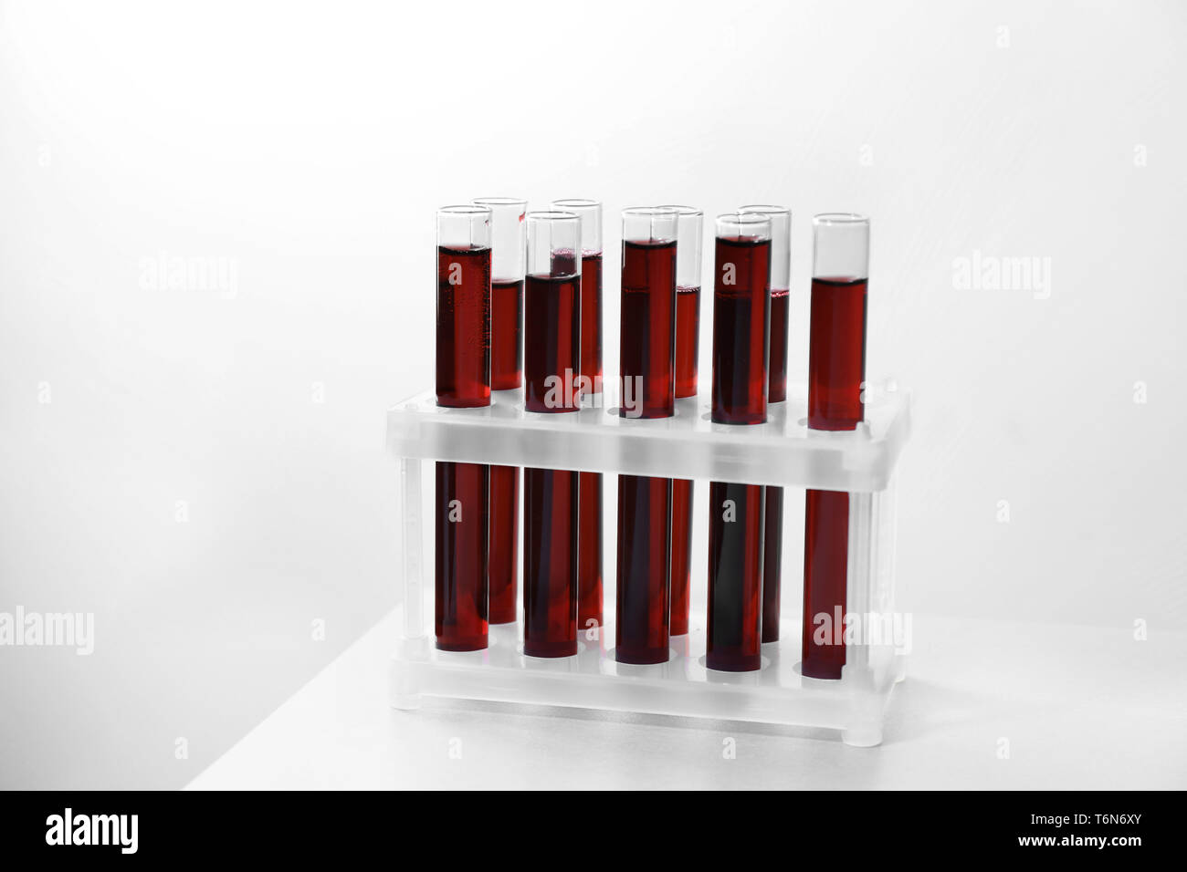 Test tubes with blood samples in holder on table Stock Photo - Alamy