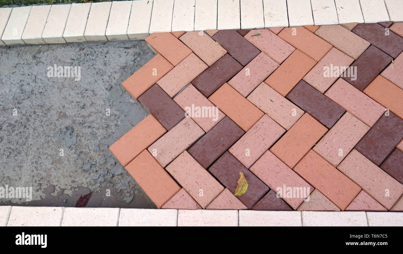 Partly finished colored brick pavement in Andalusian village Stock ...