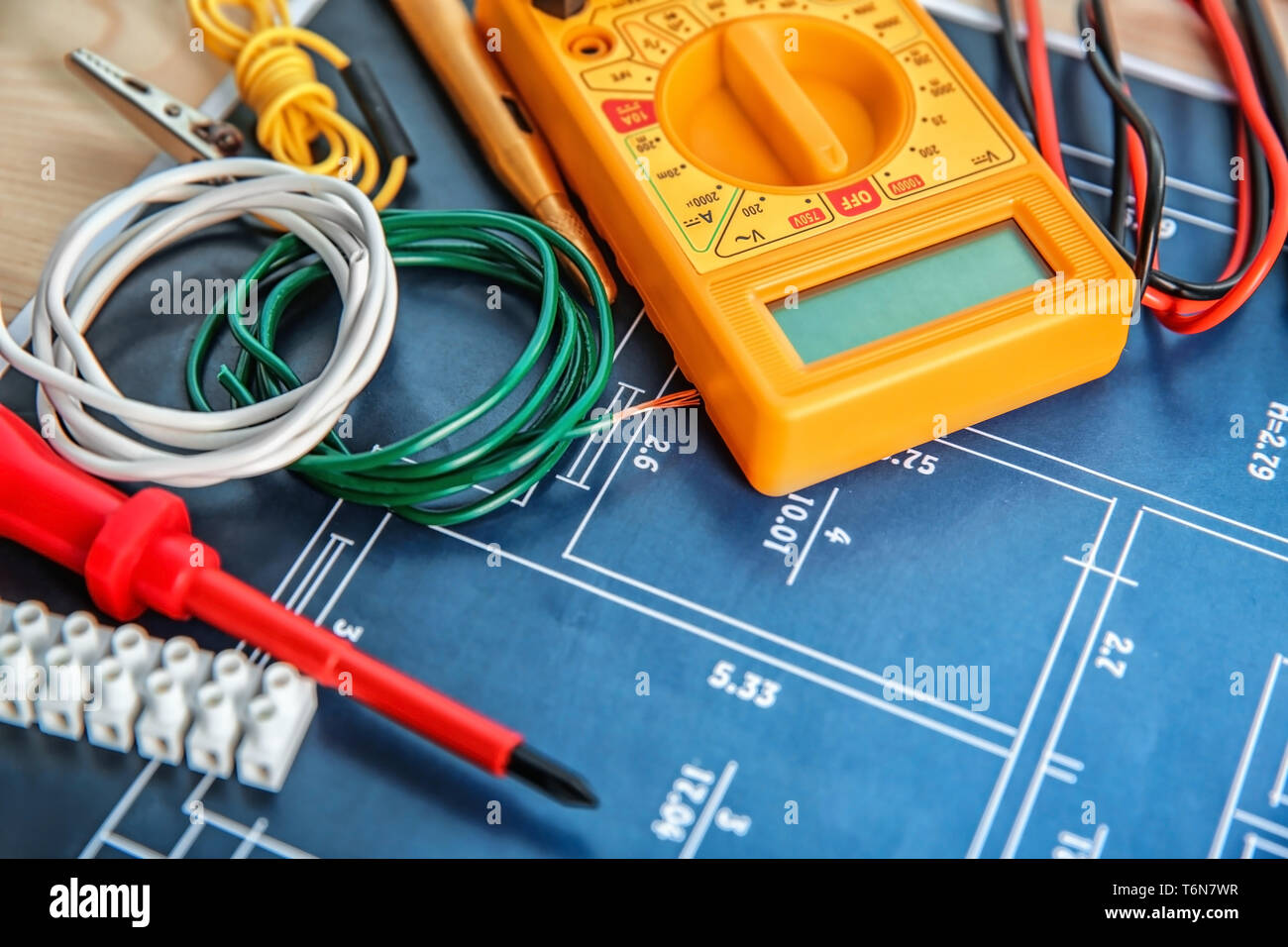 Different electrical tools on house plan, closeup Stock Photo - Alamy