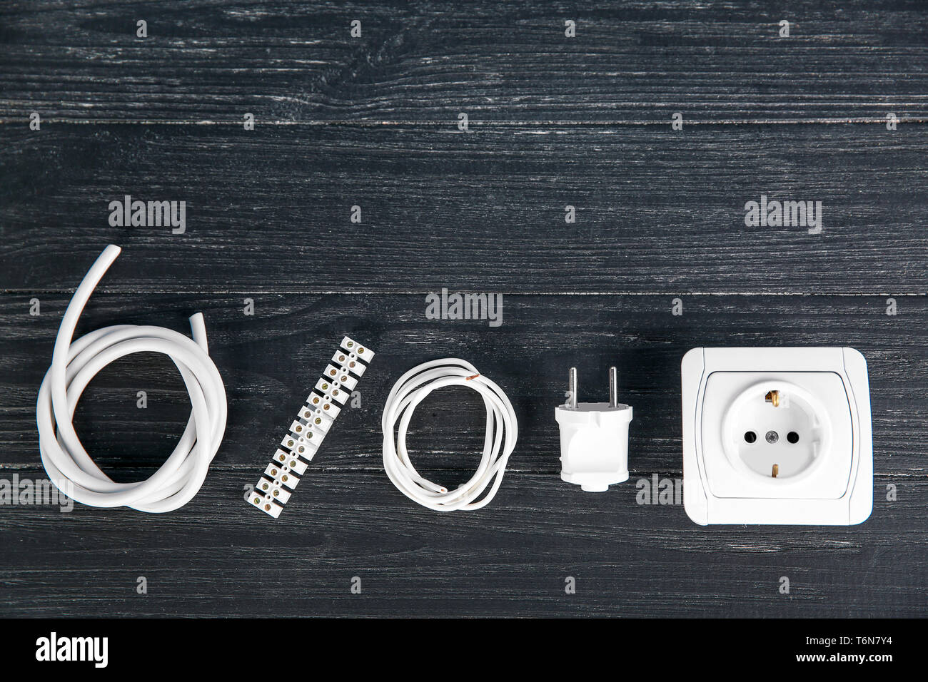 Flat lay composition with power socket, wires, plug and electrical ...