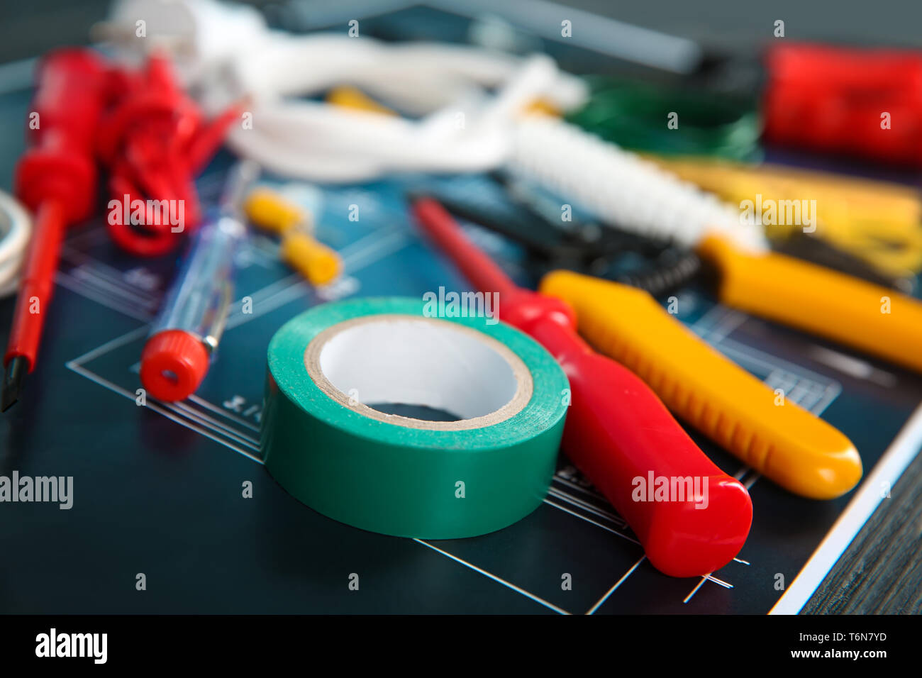Different electrical tools on house plan, closeup Stock Photo - Alamy