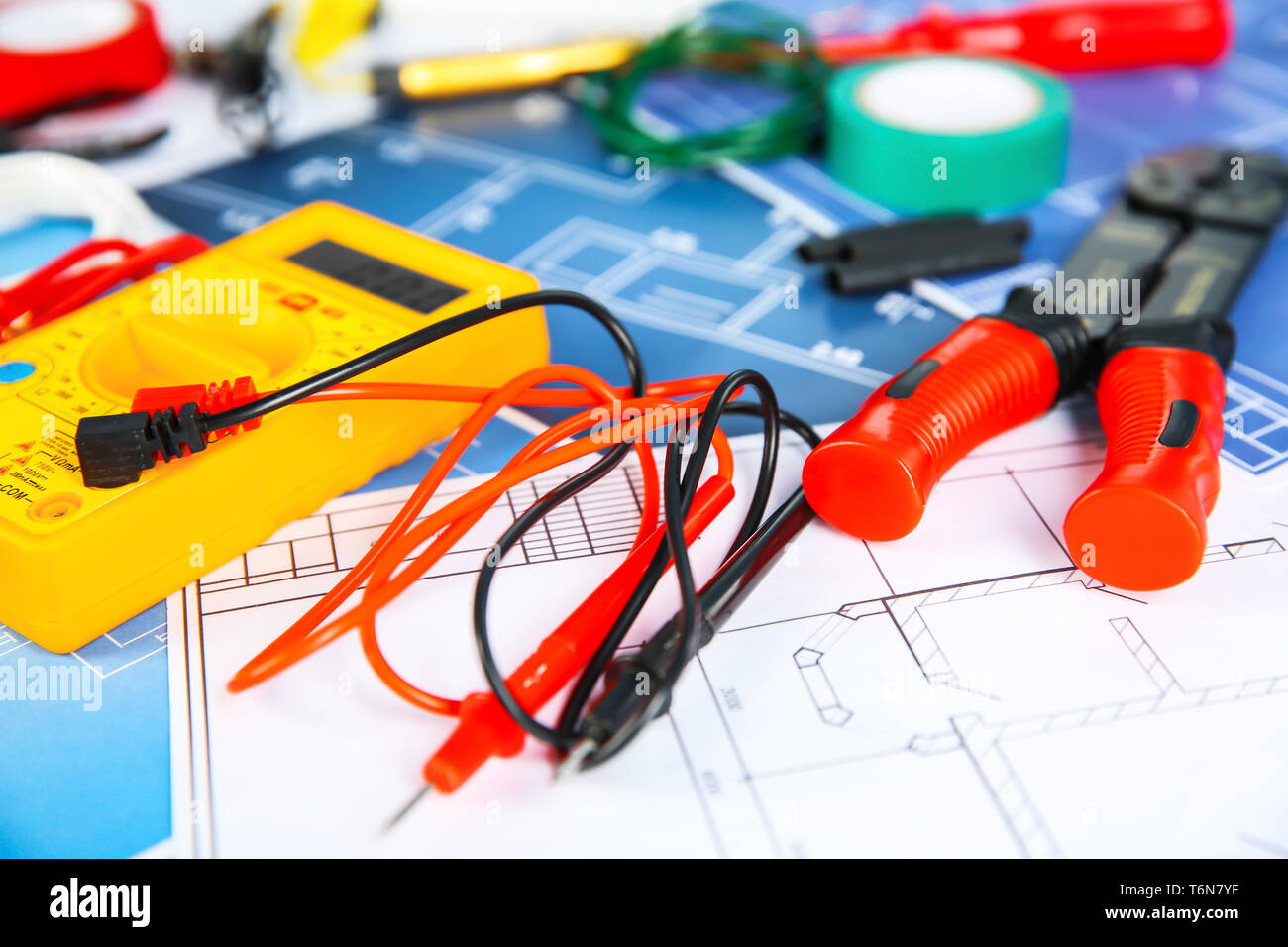 Different electrical tools on house plans, closeup Stock Photo - Alamy