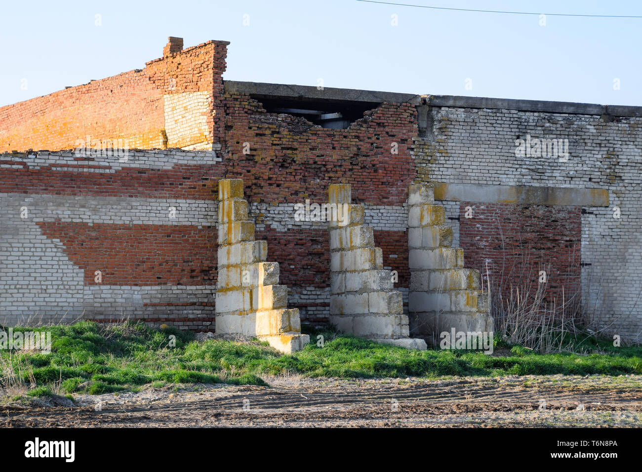 Old soviet brick abandoned building. Collapsing brick construction ...