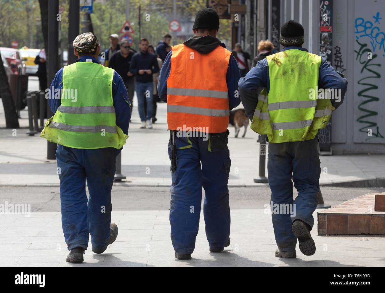 Bucharest, Romania - April 22, 2019: Three construction workers dressed ...