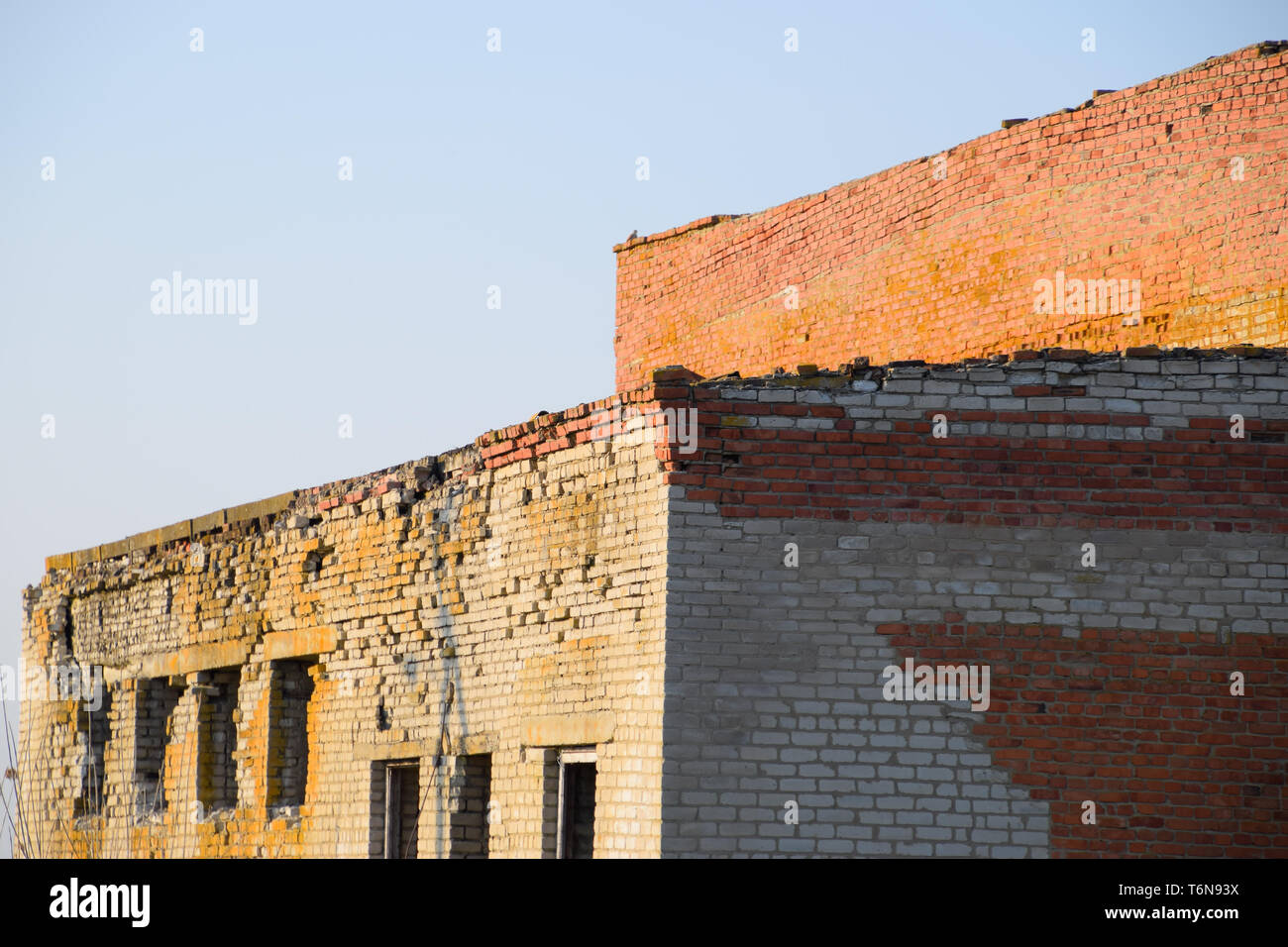 Old soviet brick abandoned building. Collapsing brick construction ...