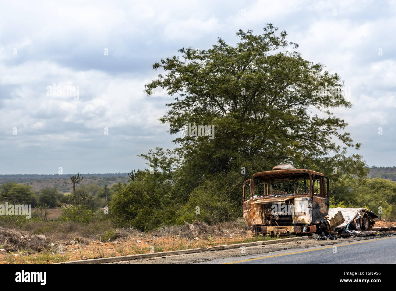 Bengo Province in Angola. Abandoned cars at the road. Africa in hands ...
