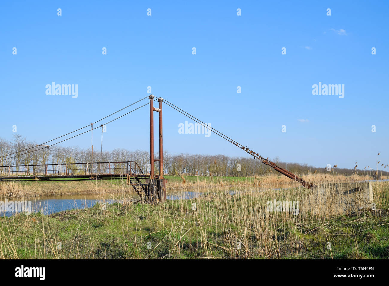 Steel bridge and gas pipeline through the irrigation canal Stock Photo ...