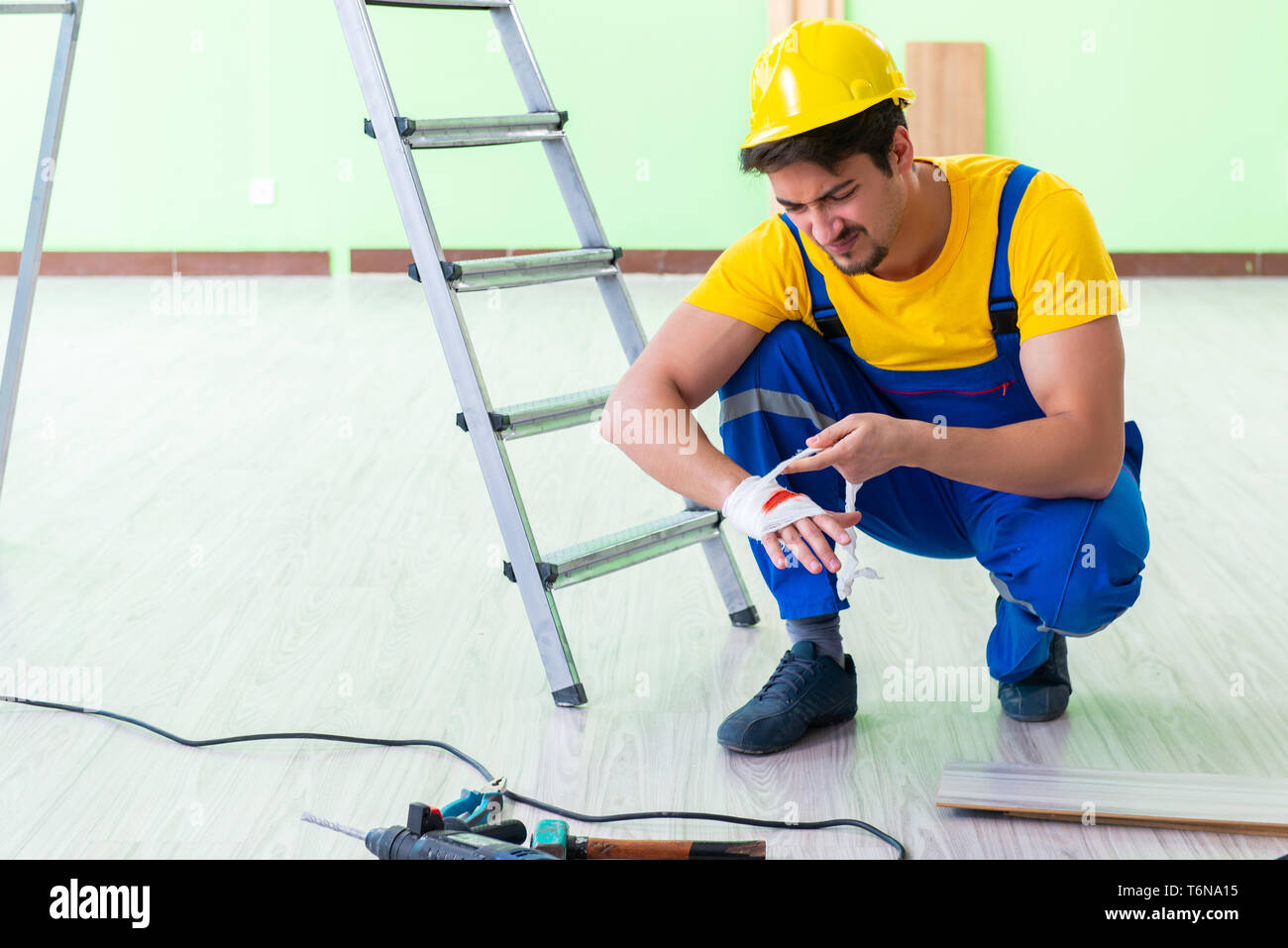 The injured worker at the work site Stock Photo - Alamy