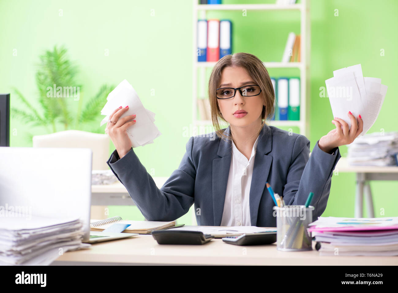 The female financial manager working in the office Stock Photo - Alamy